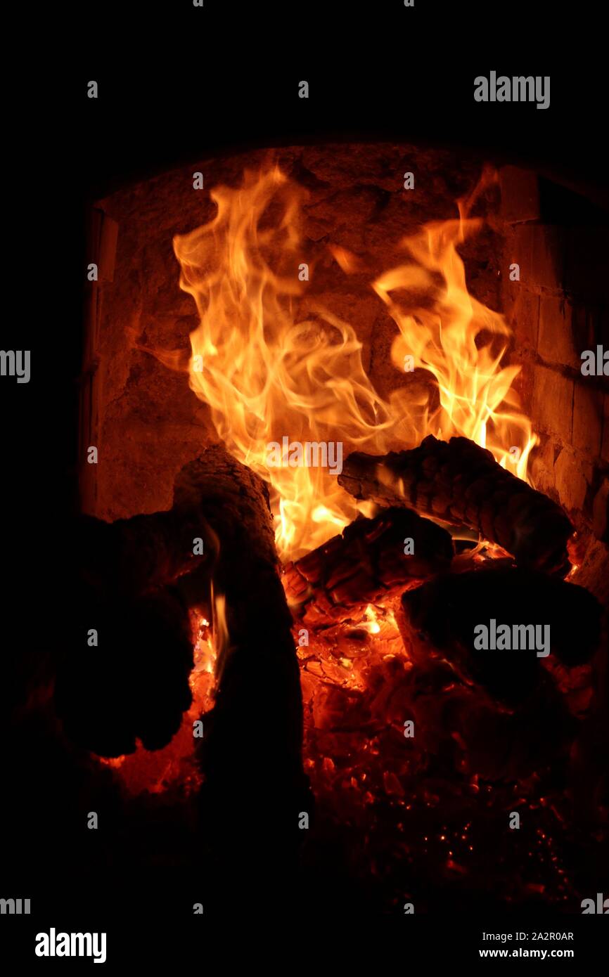 Fireplace in cold winter Stock Photo - Alamy