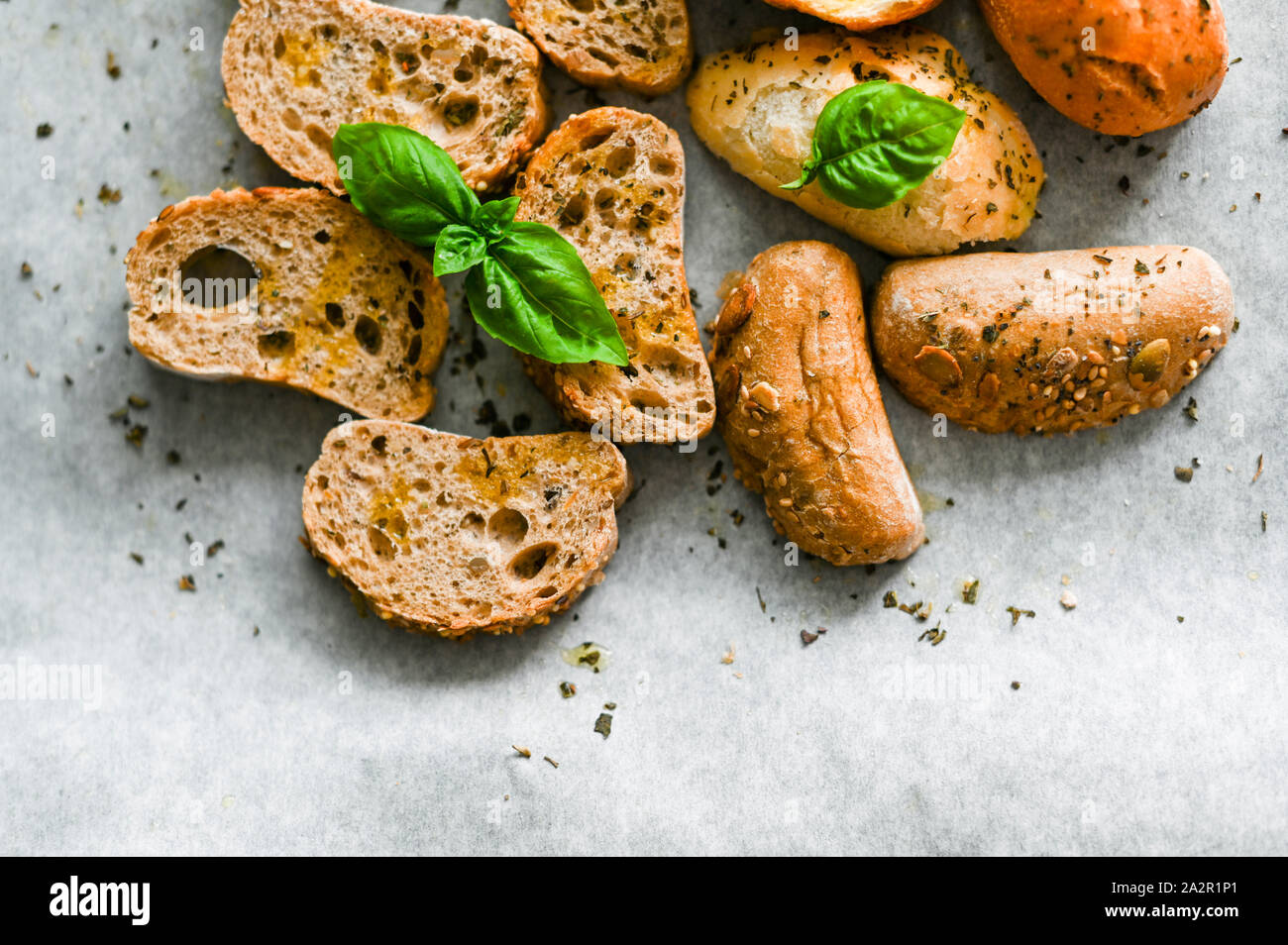 Oven baked bruschetta with basil and olive oil in the oven. Traditional ...