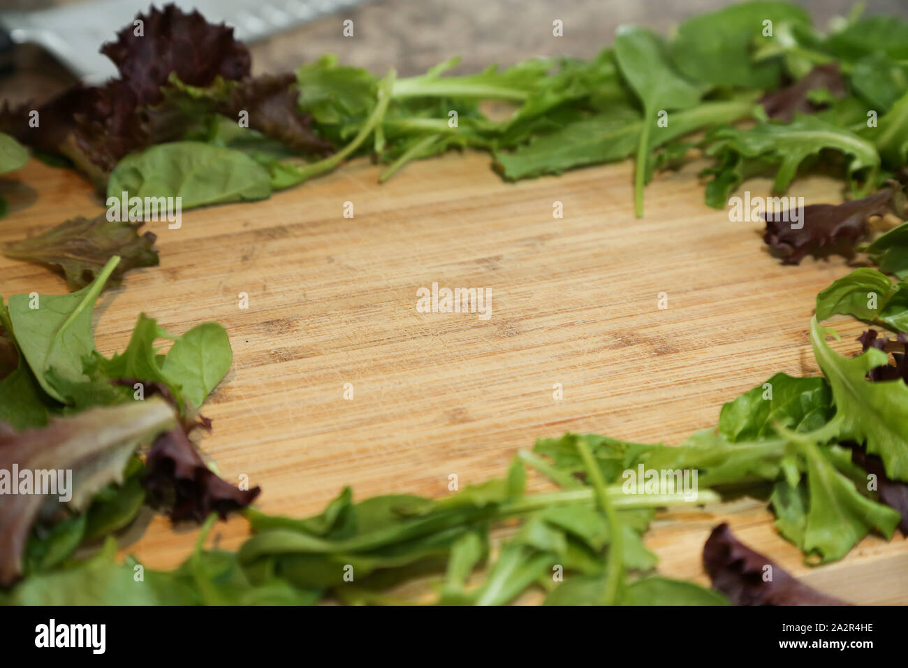 Spring mix lettuce frame, lettuce frame on a chopping board Stock Photo ...