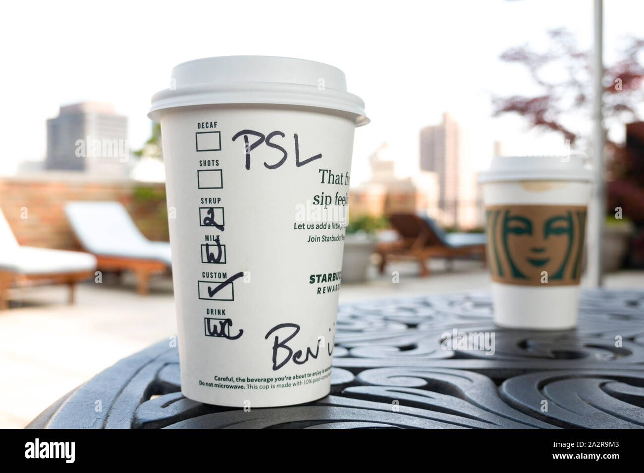 Starbucks Coffee to-go on a patio table, USA Stock Photo - Alamy