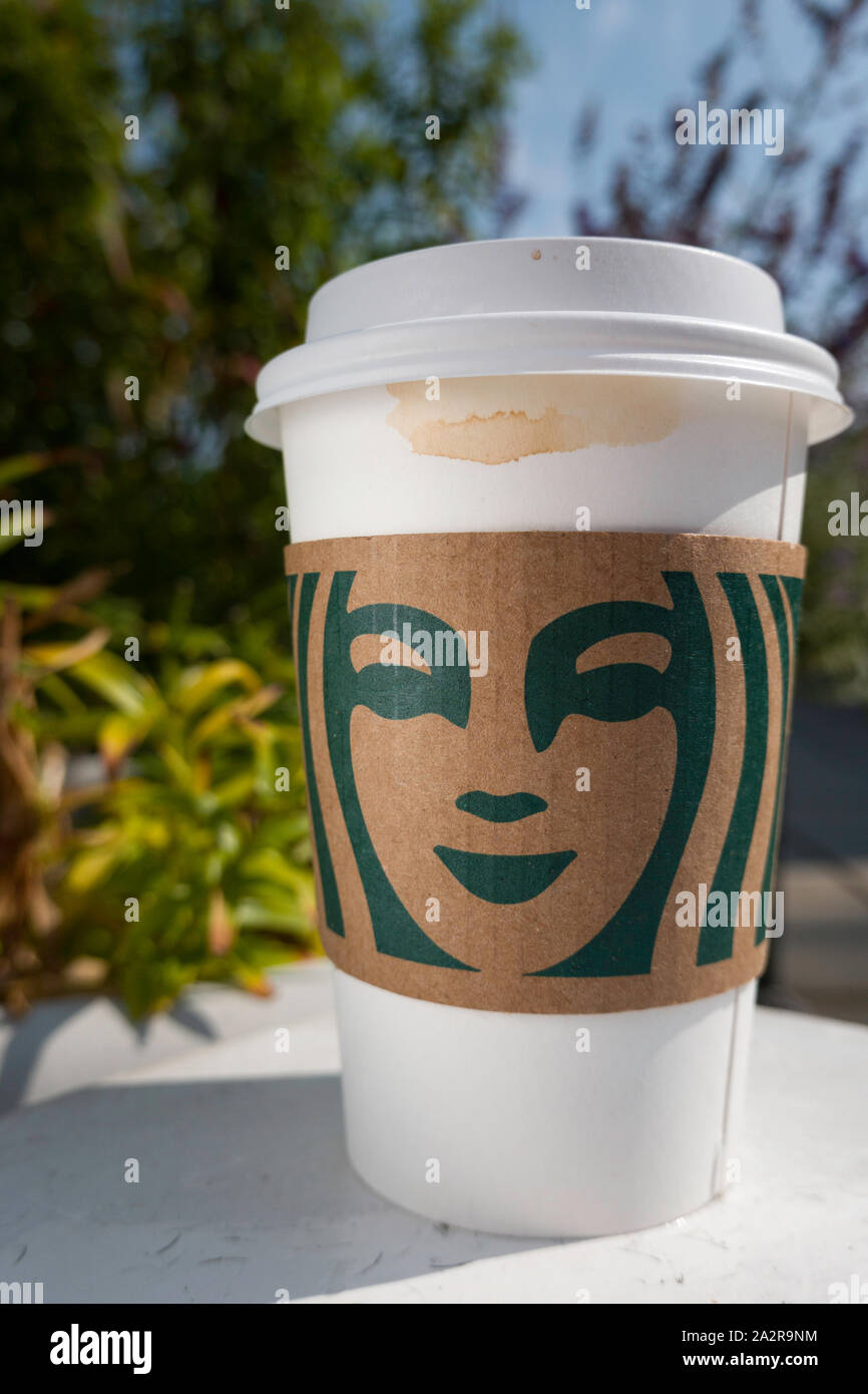 Starbucks Coffee to-go on a patio table, USA Stock Photo - Alamy