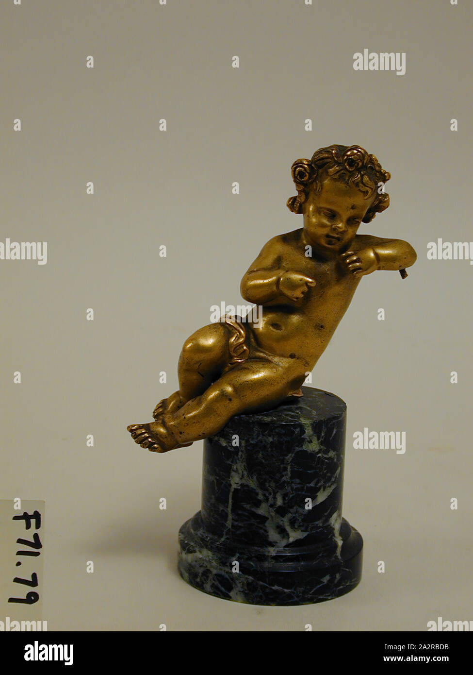 manner of Etienne Maurice Falconet, French, 1716-1791, Seated Putto ...