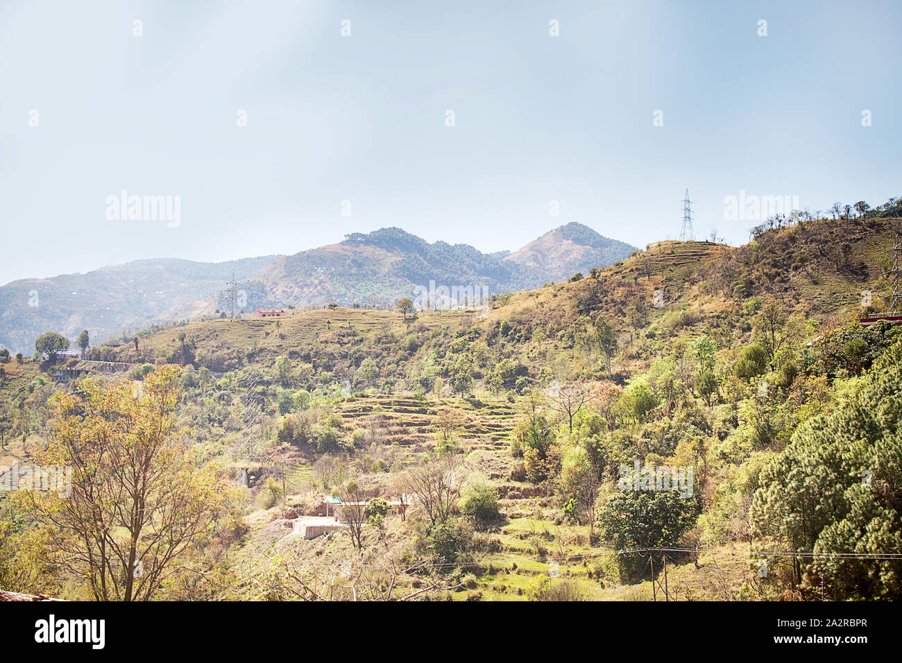 Terrace farming the mountains on the poor stony soils in India. Tiny ...