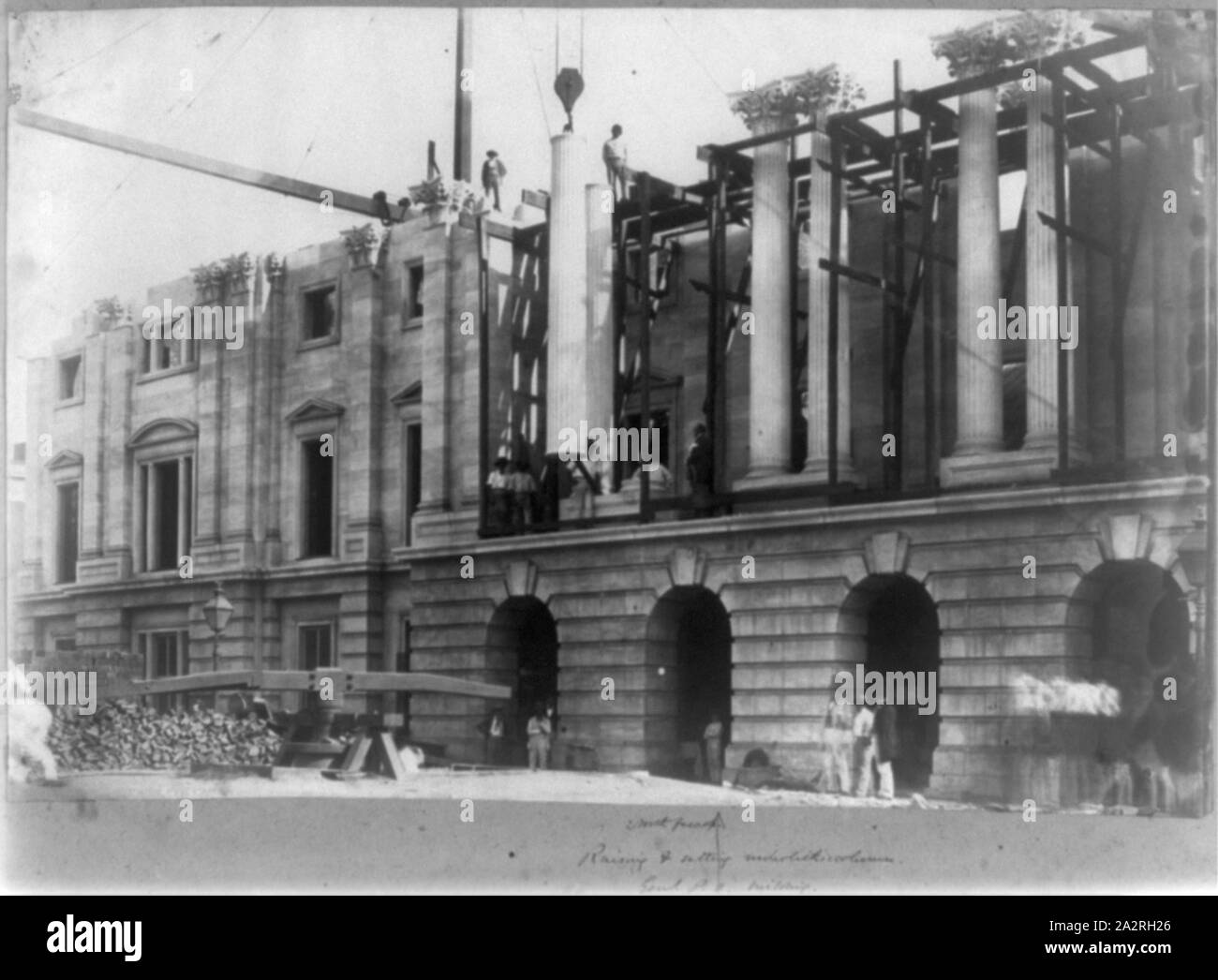 Raising and setting monolithic column, Genl. P.O. Building; Photograph ...