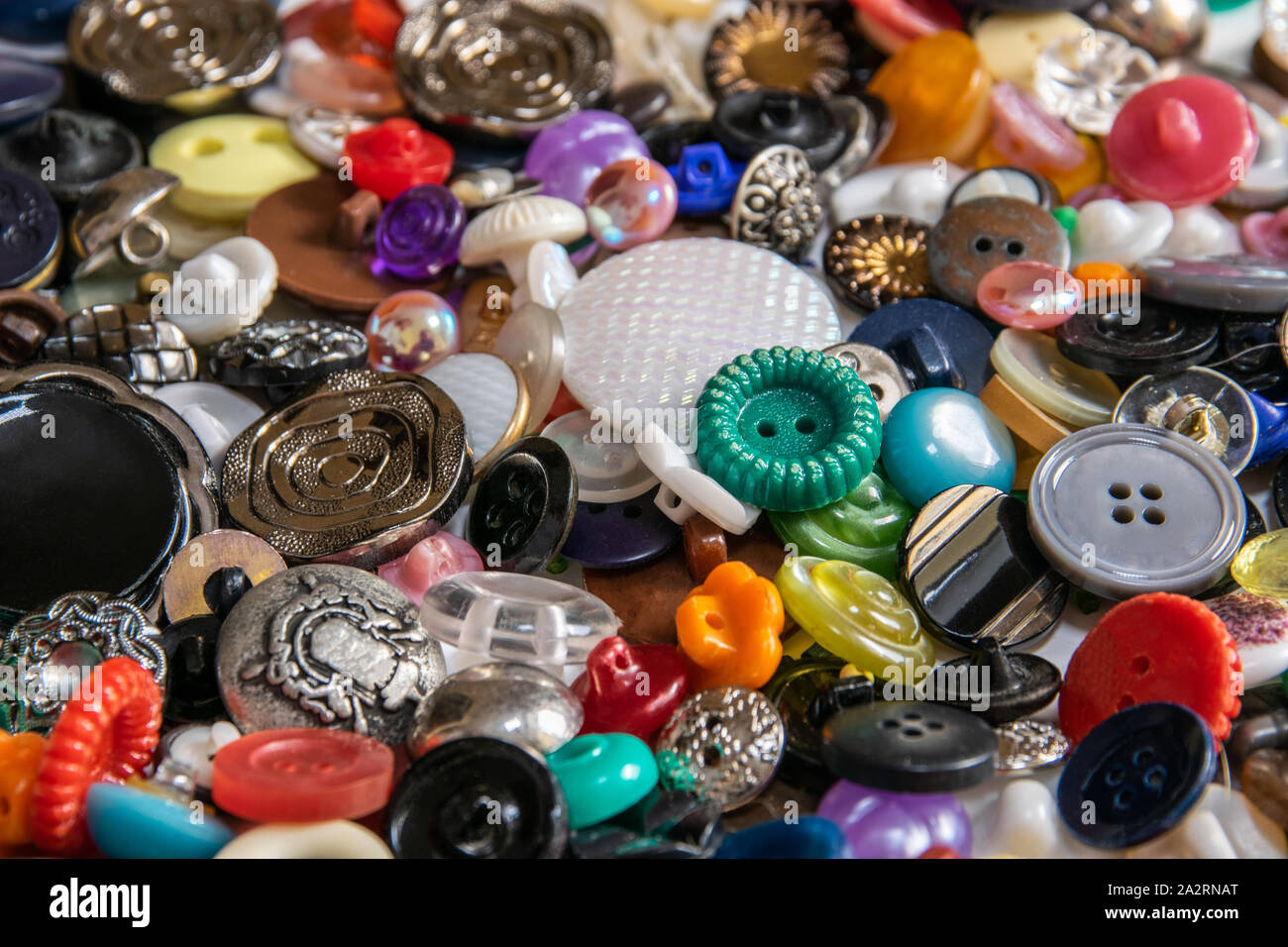 many scattered old color buttons. Buttons for needlework Stock Photo ...