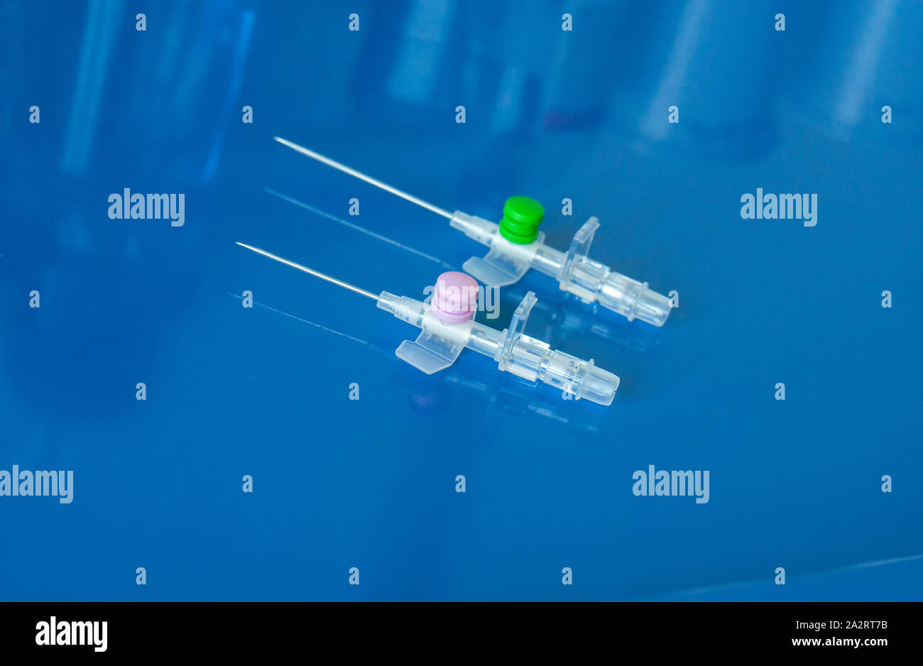 Couple of peripheral venous catheters placed on the therapy trolley in ...
