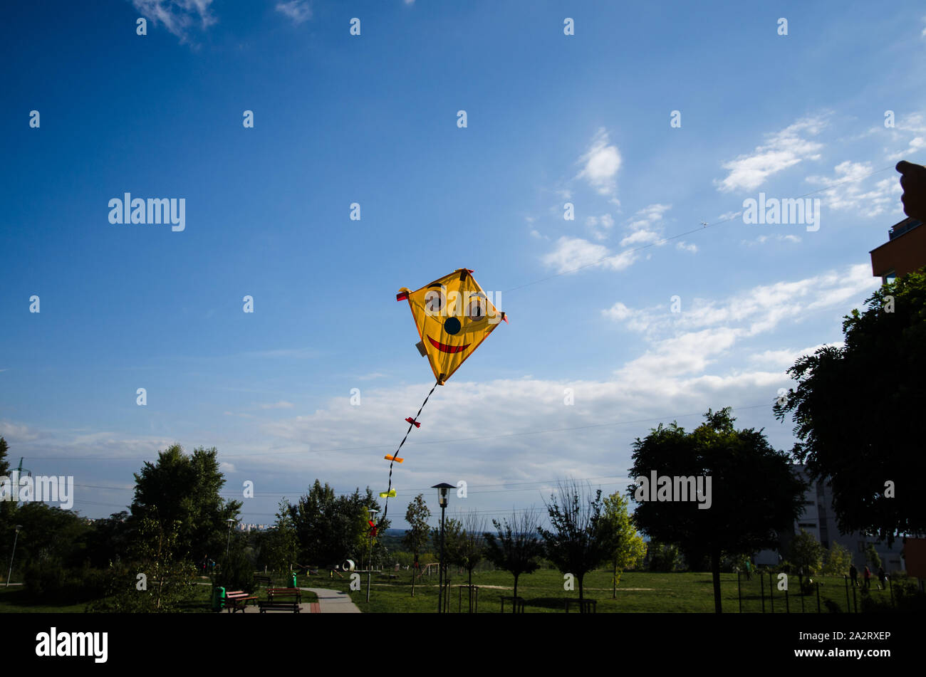colorful happy smiling kite flying in urban settlement unit Stock Photo ...