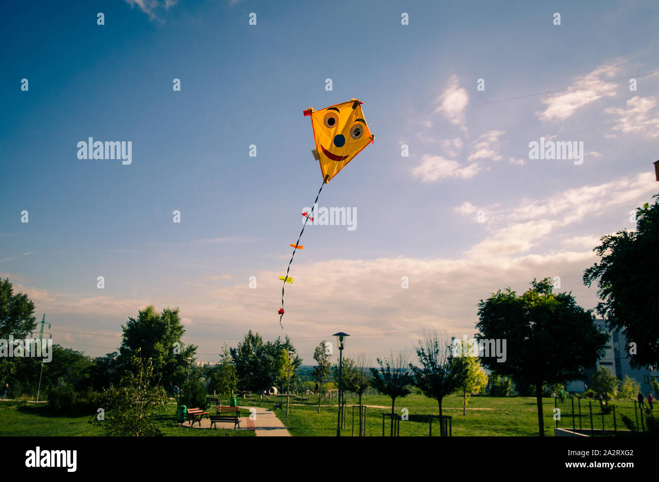 colorful happy smiling kite flying in urban settlement unit Stock Photo ...