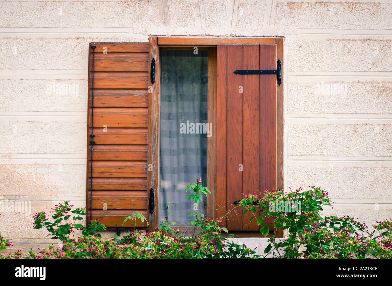 wooden window half open in stone wall and plants Stock Photo - Alamy