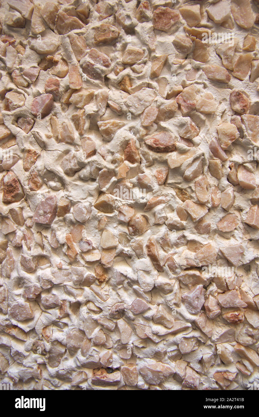 Close-up of a wall with stone mono layer mortar projected on the ...