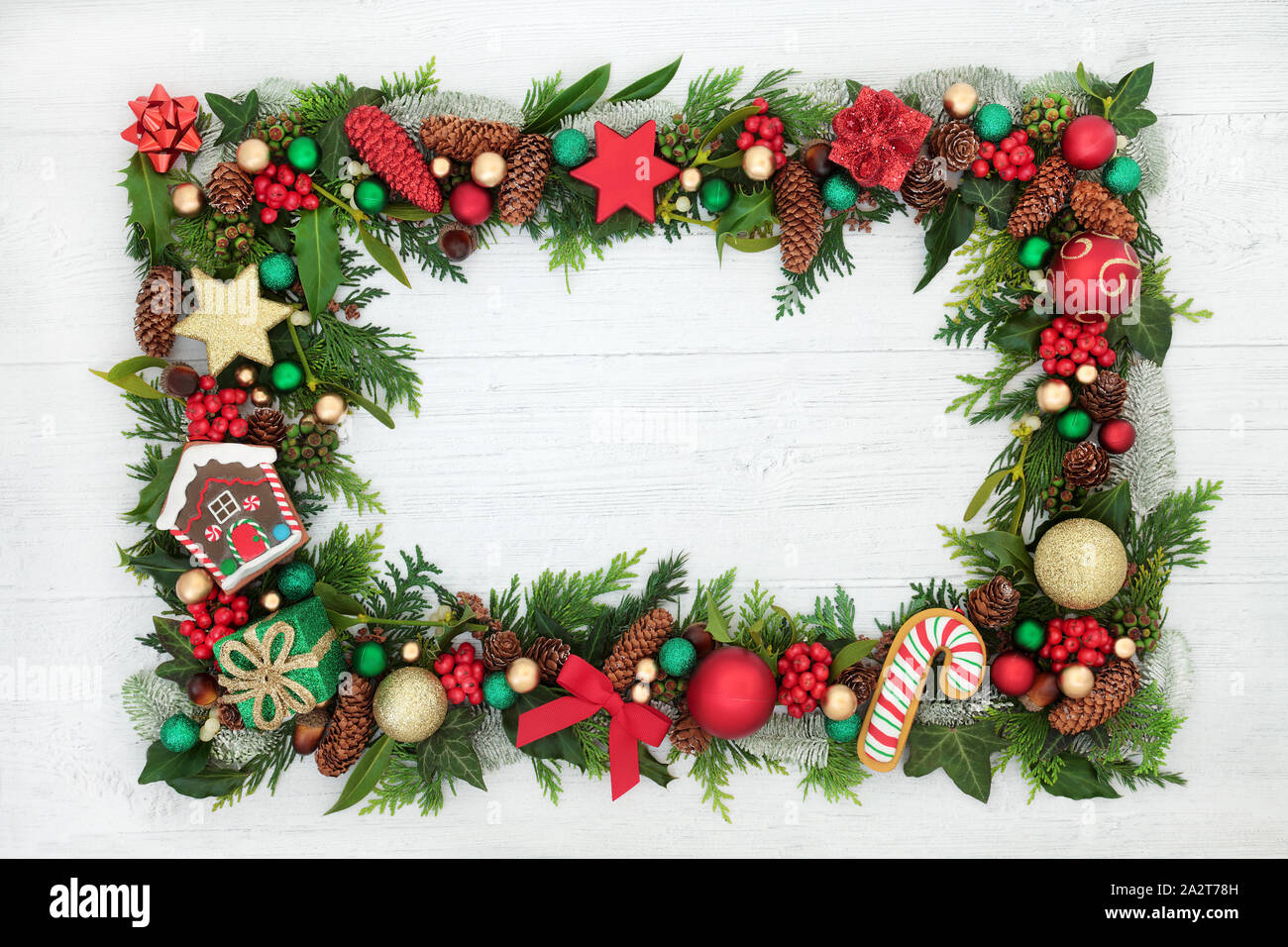 Festive Christmas background border with bauble decorations, holly ...