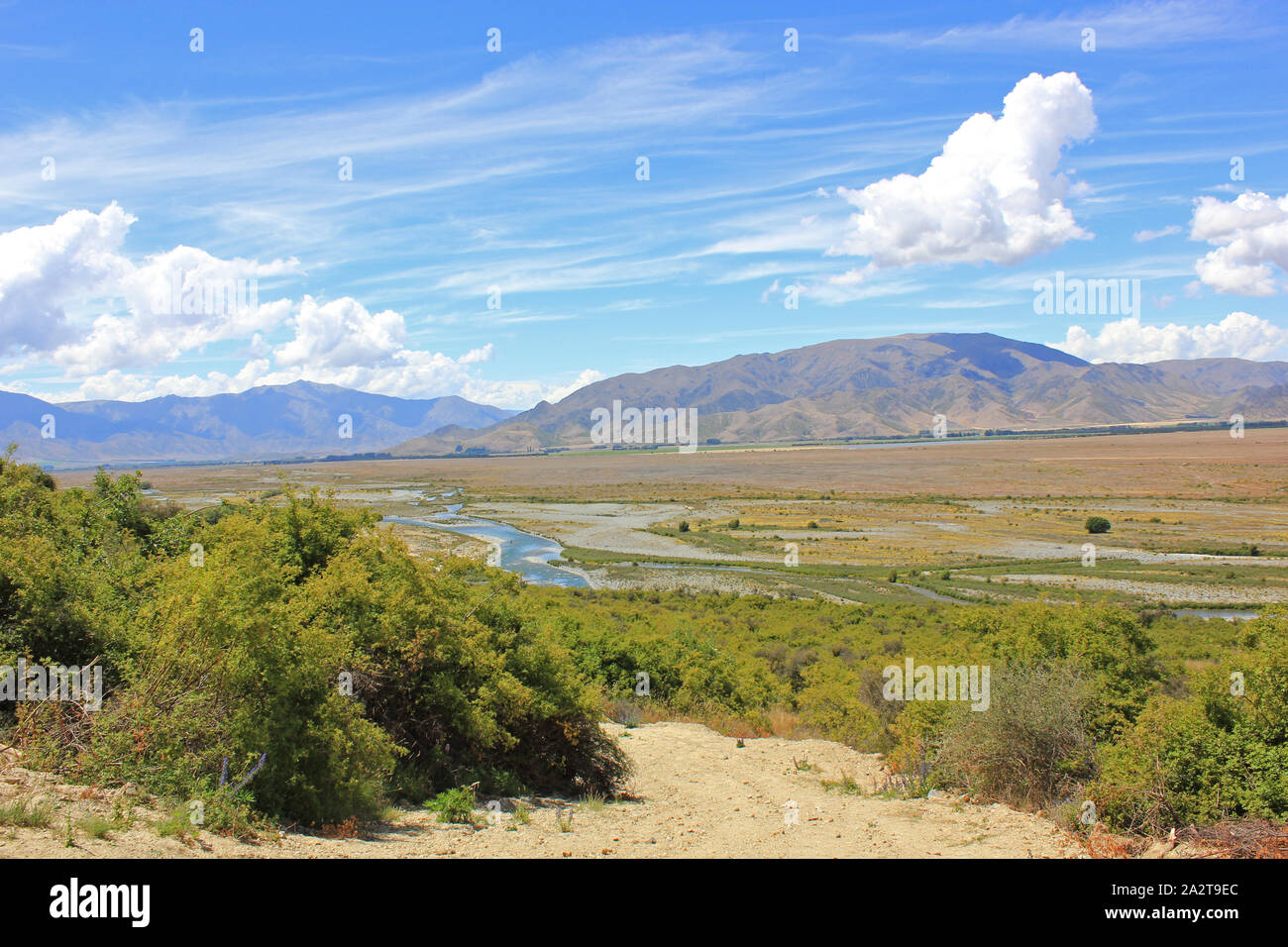 Plainland with mountains in the background in new zealand Stock Photo ...