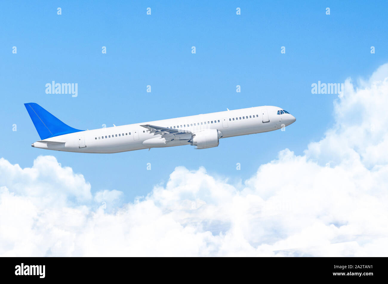 Side view of an airplane flying above the clouds high in the sky Stock ...