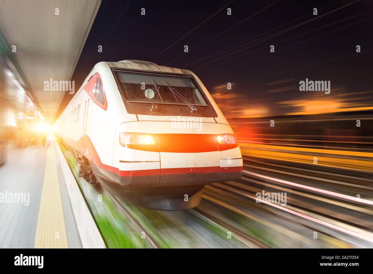 Train rides on a trip at the railway station in the city at night Stock ...