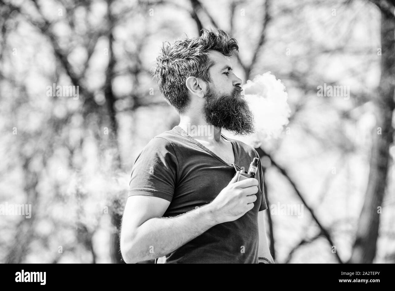 Mature hipster with beard. hipster man hold vaping device. Health ...