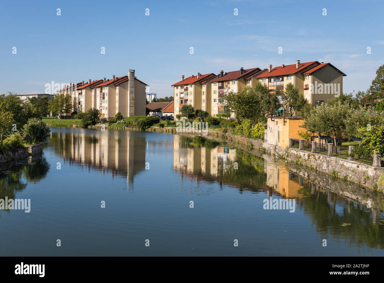 Buildings reflecting in the Rinza River - Kocevje, Slovenia Stock Photo ...