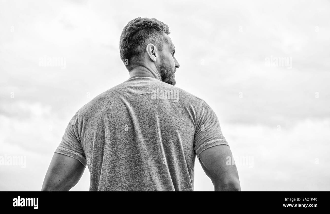 Strong muscular body feeling powerful rear view. Successful athlete ...