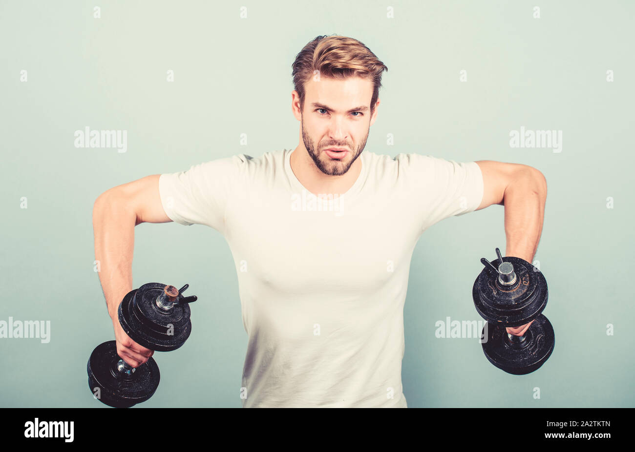 Sportsman training strong muscles. Sport equipment. Fitness and ...