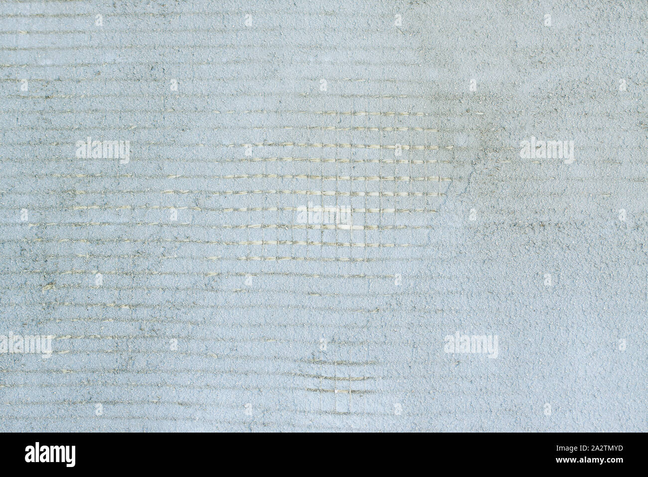 Texture of a plastered unpainted wall with a leveling mesh. Suitable ...