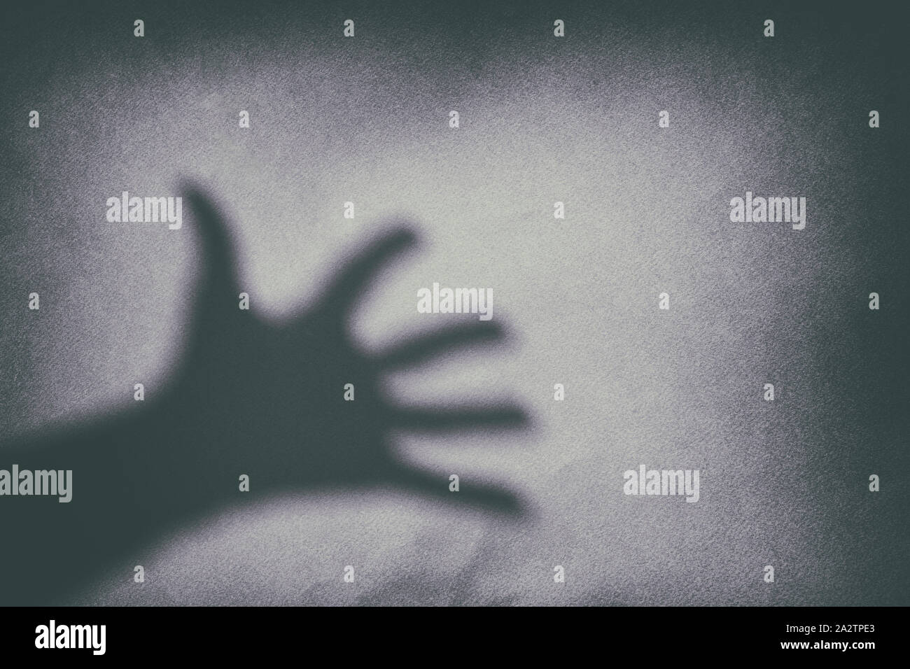 Shadow of hand with the apart fingers on dark background, scary and ...