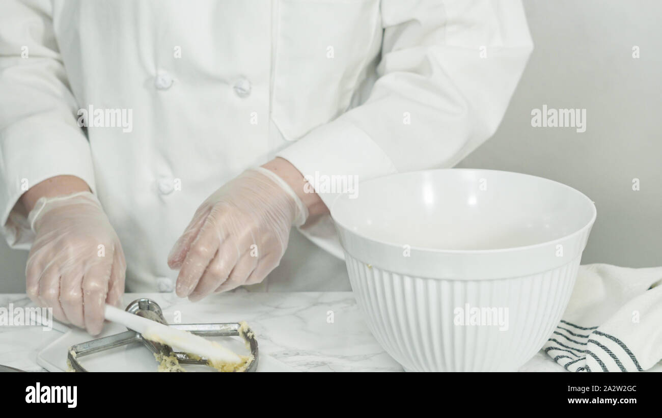 Step by step. Mixing ingredients in standing kitchen mixer to bake ...