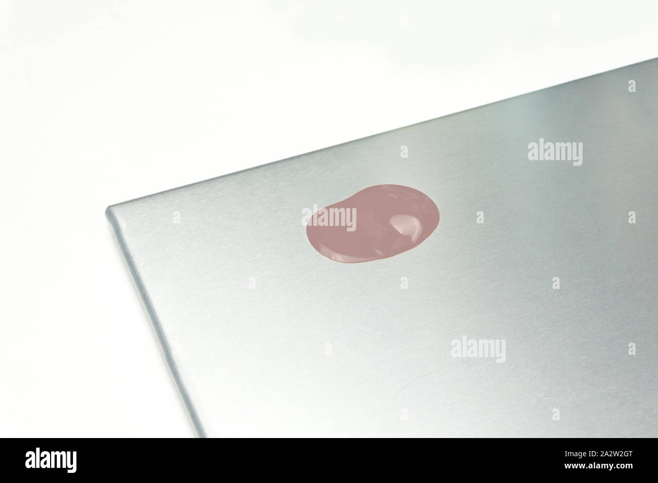 makeup foundation drop on silver palette Stock Photo - Alamy