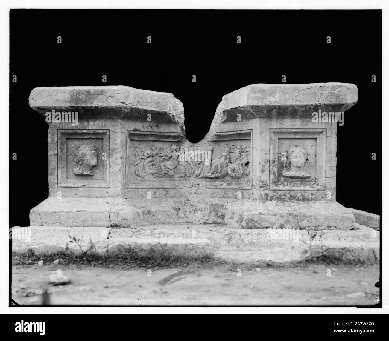 Relief sculpture on basin of lustration, Baalbek Stock Photo - Alamy