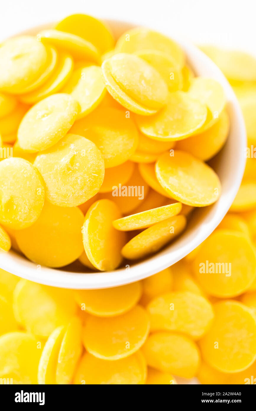 Yellow round chocolate chips for melting chocolate shapes Stock Photo ...