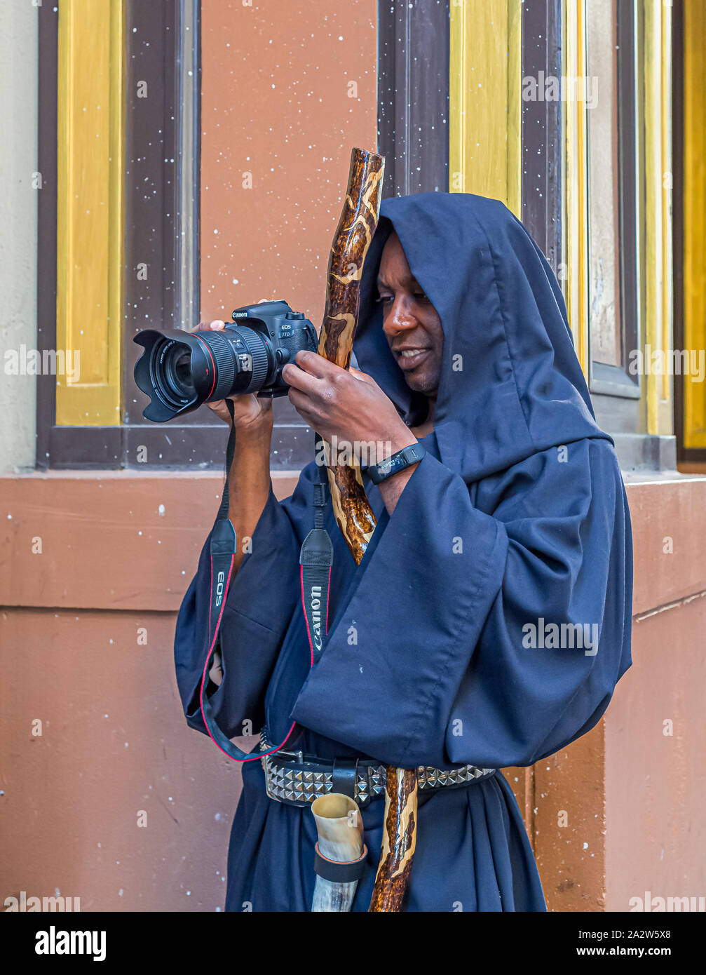 Ancient Priest with Modern Camera Stock Photo - Alamy