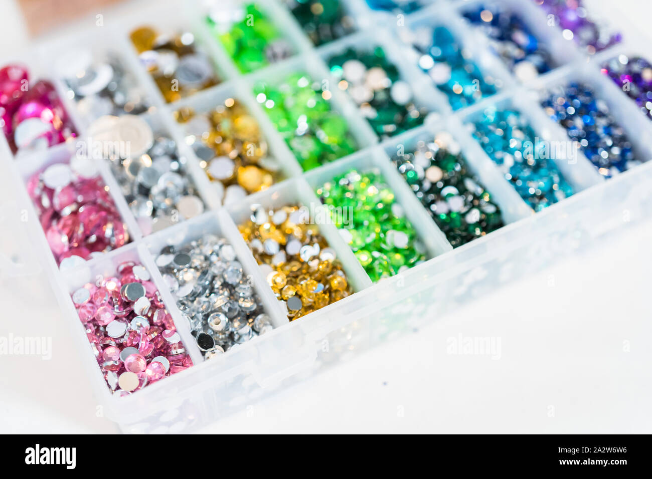 Color and size variety of rhinestones in the craft box Stock Photo - Alamy