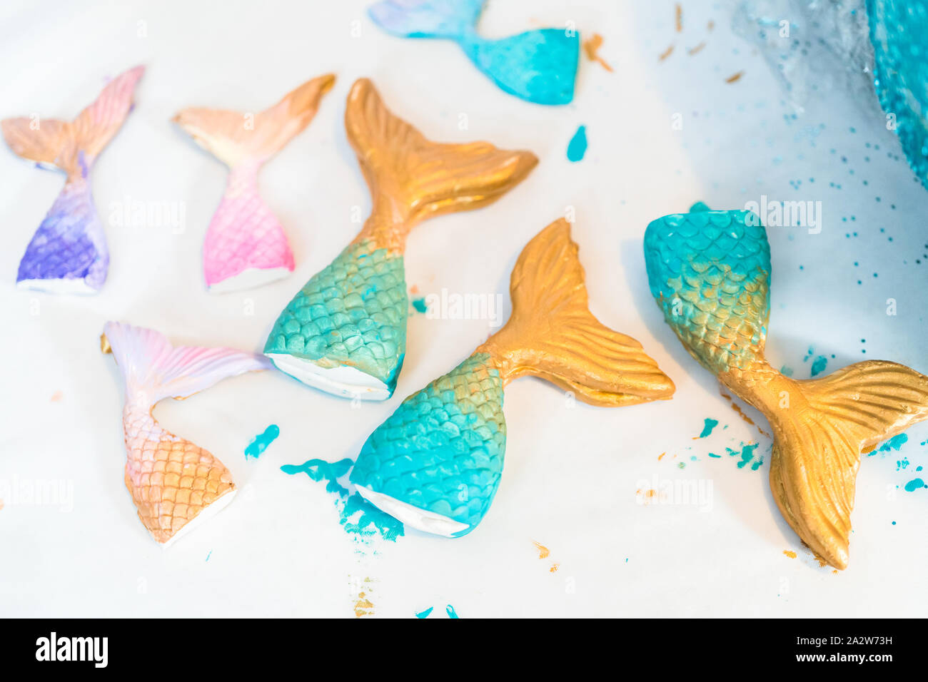 Mermaid tails made out of modeling clay and painted with acrylic paint ...