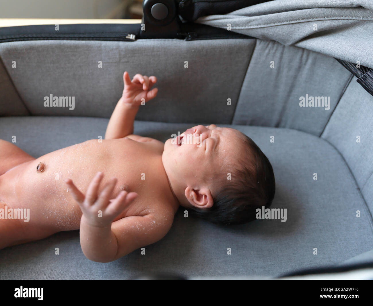 Week old baby boy crying hi-res stock photography and images - Alamy