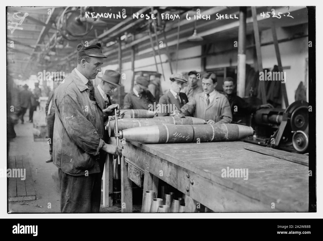 Removing nose from 6 inch shell Stock Photo - Alamy
