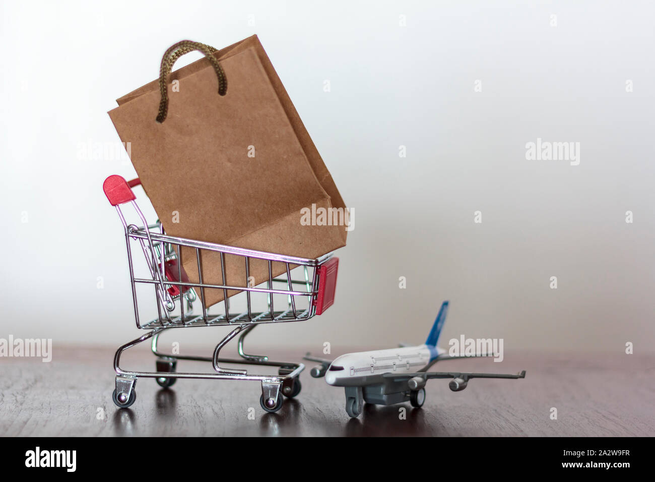 Shopping bag in trolley and airplane. Worldwide shopping concept Stock ...