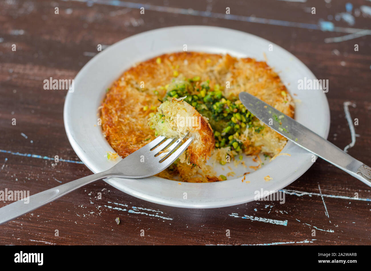 Delicious traditional Turkish dessert: Kunefe kadayif with pistachio ...