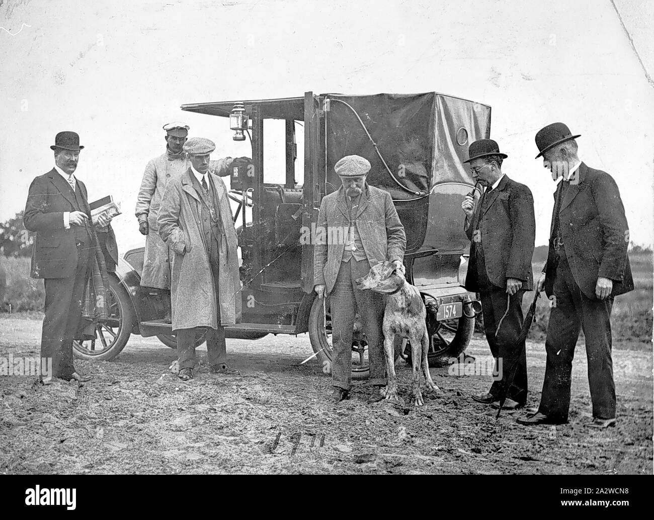 Negative - Victoria, 1911, A group of men in front of a motor car. The ...