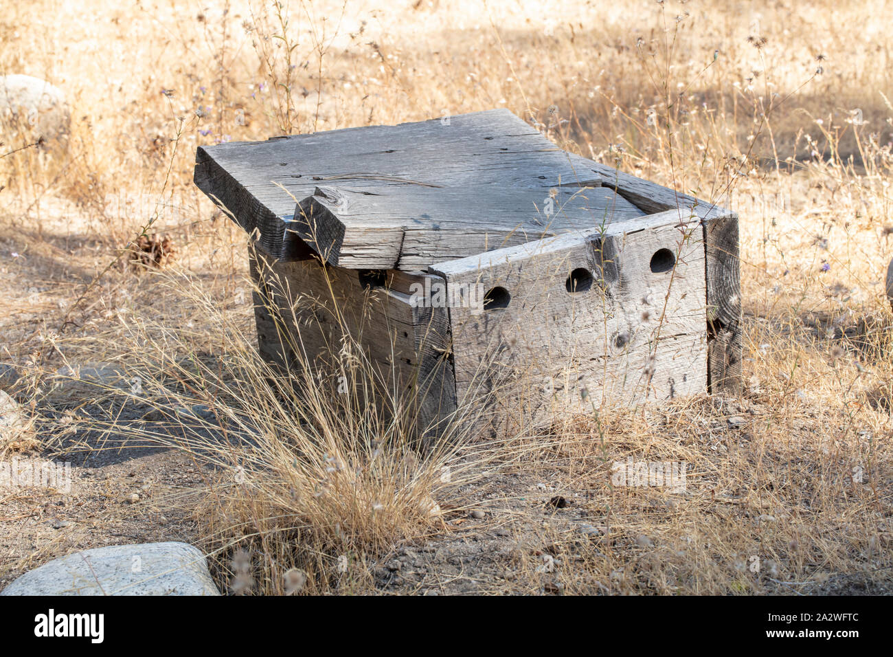 Old wooden abandoned box on dirt road Stock Photo - Alamy