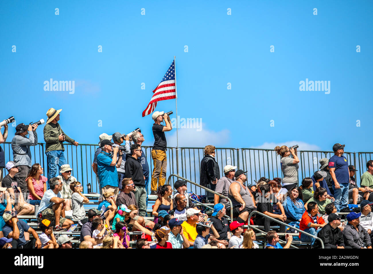Sitting watching spectator crowded sport hi-res stock photography and ...