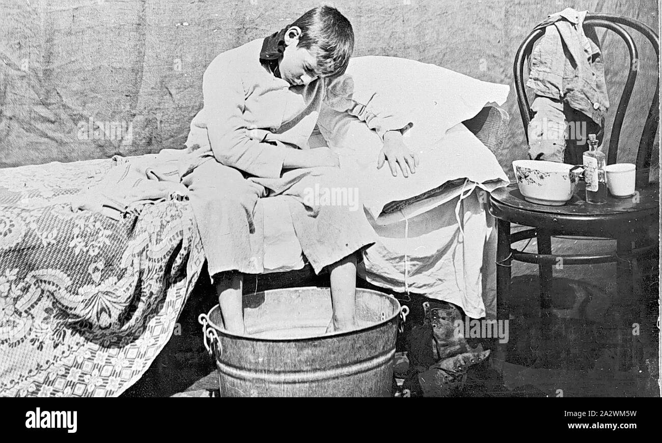 Negative - Boy Seated on Bed With Feet in a Washtub, Merrigum, Victoria ...