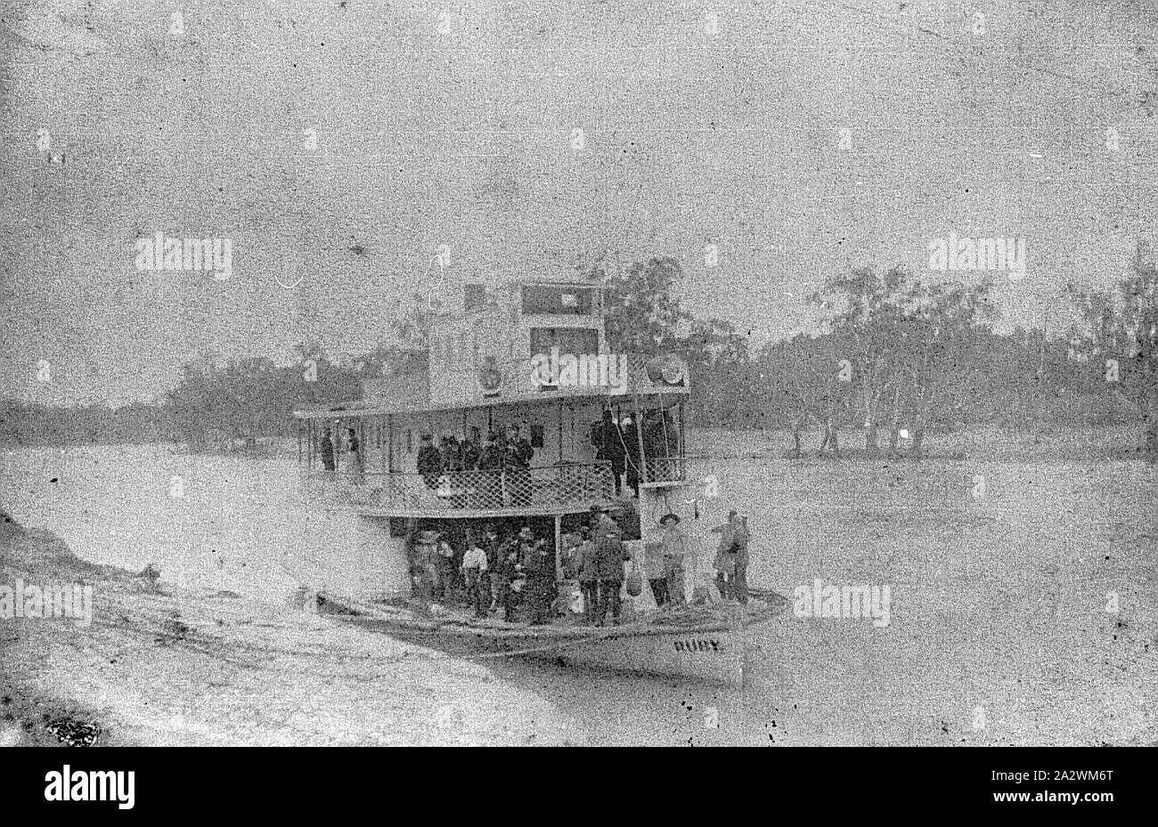 Negative - People on the Ruby Paddle Boat Tied to the Riverbank ...