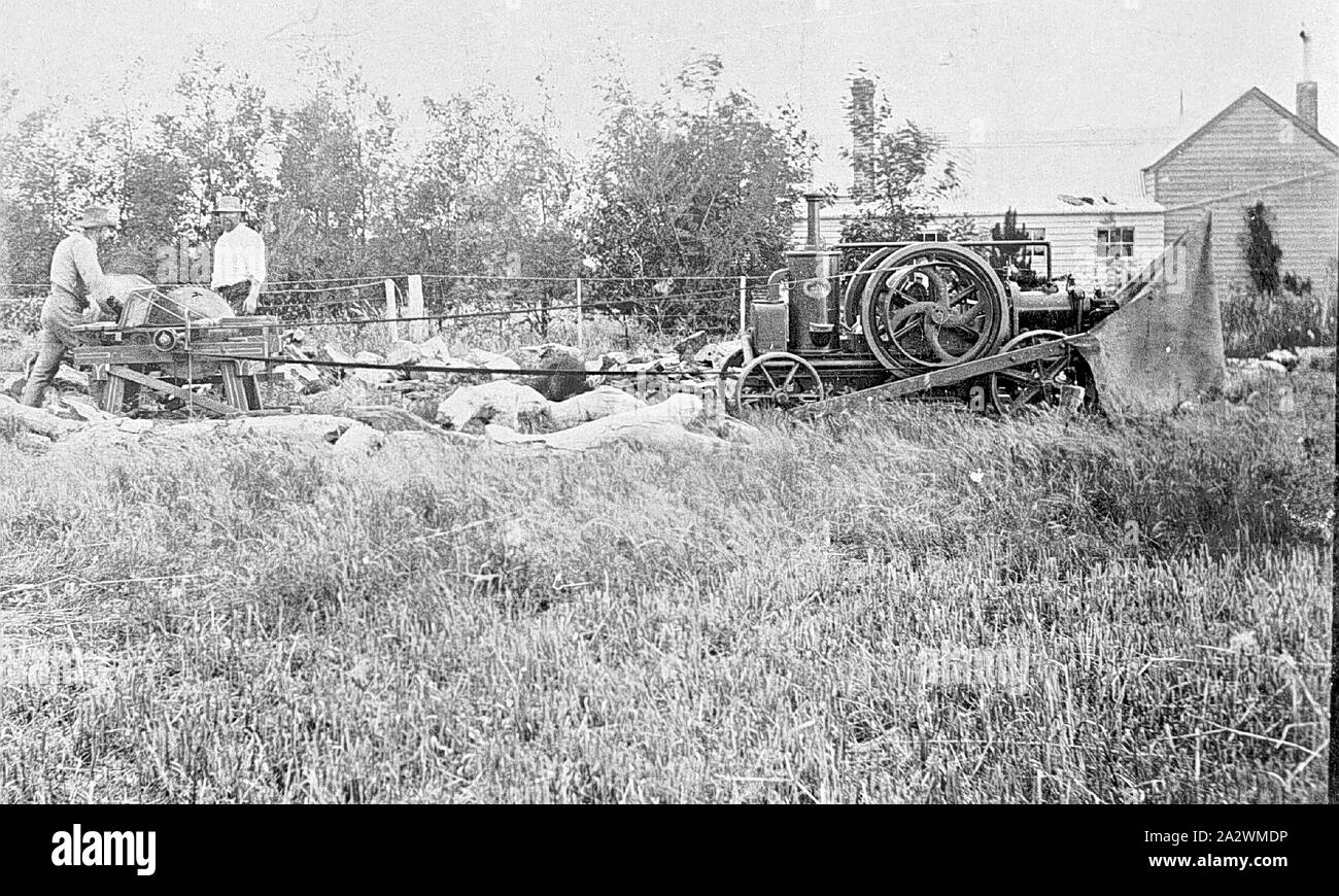 Negative - Men Using a 'Ronaldson Tippett' 5hp Engine to Saw Wood ...