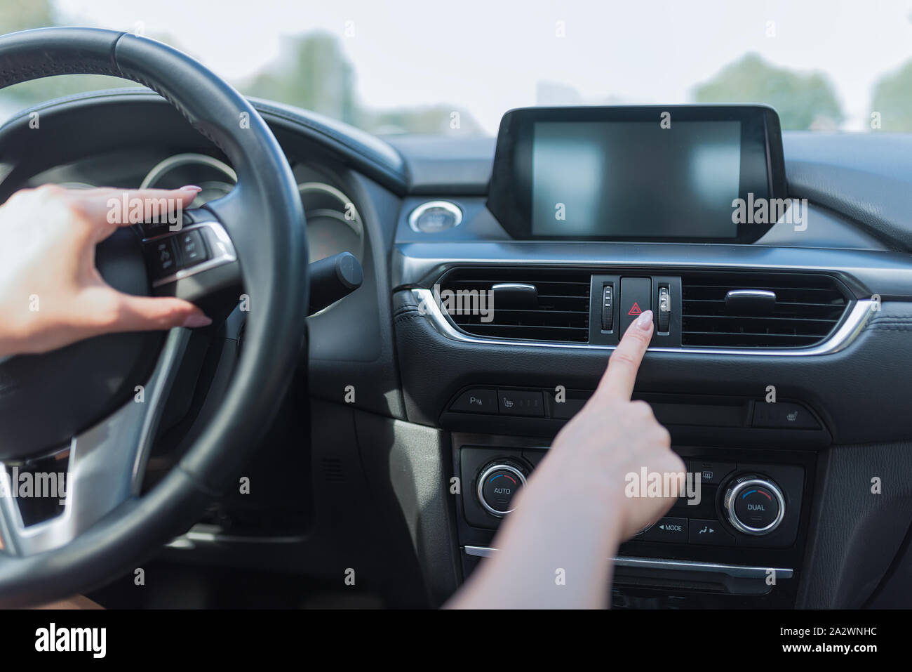 Close-up, female hand presses emergency stop button, alarm accident on ...