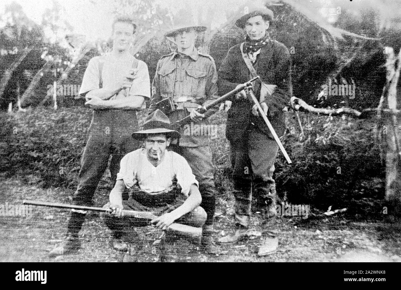 Negative - Victoria (?), circa 1925, Hunting party of four men, three ...