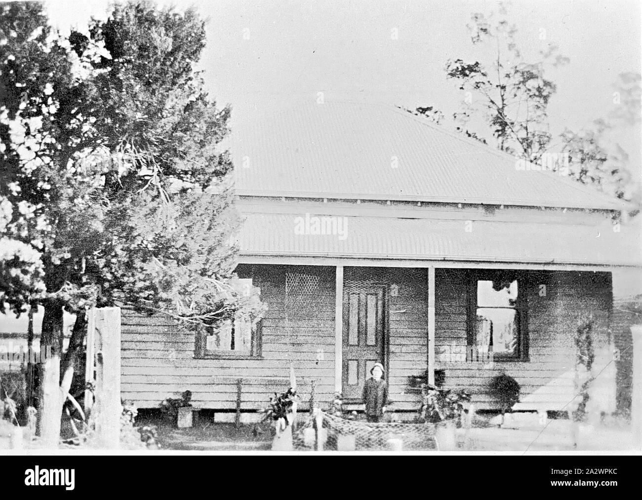 Negative - House at Cocamba, Victoria, 1917, A small child in front of ...