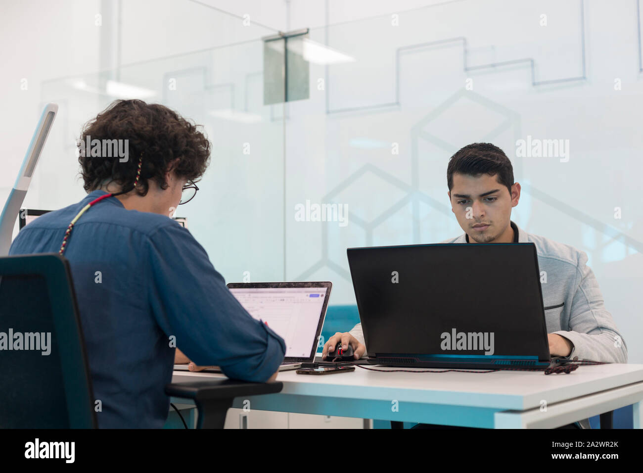 Coworking men office desk hi-res stock photography and images - Alamy