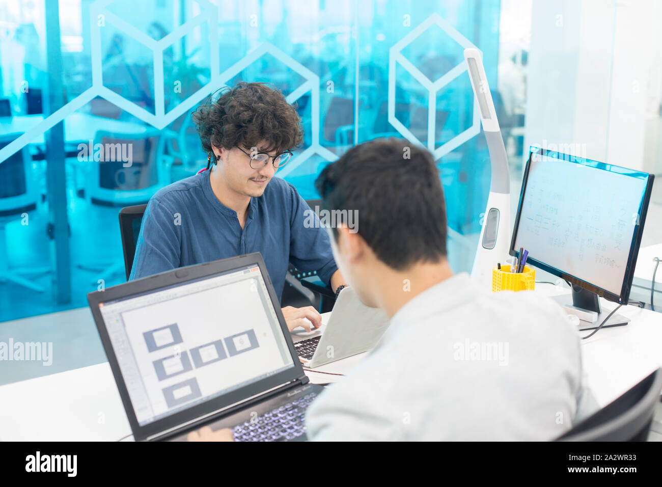 Coworking men office desk hi-res stock photography and images - Alamy