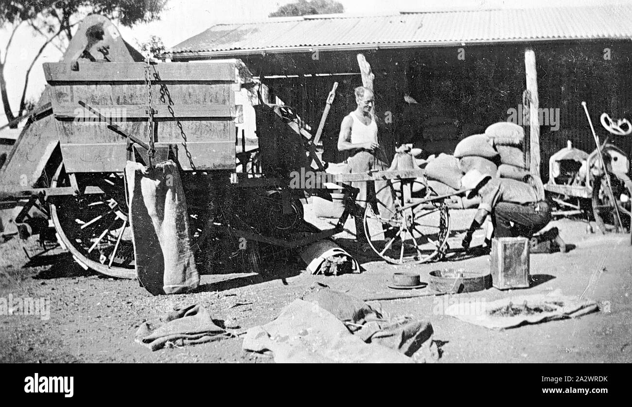 Negative - Manangatang, Victoria, 1933, Two men repairing a harvester ...
