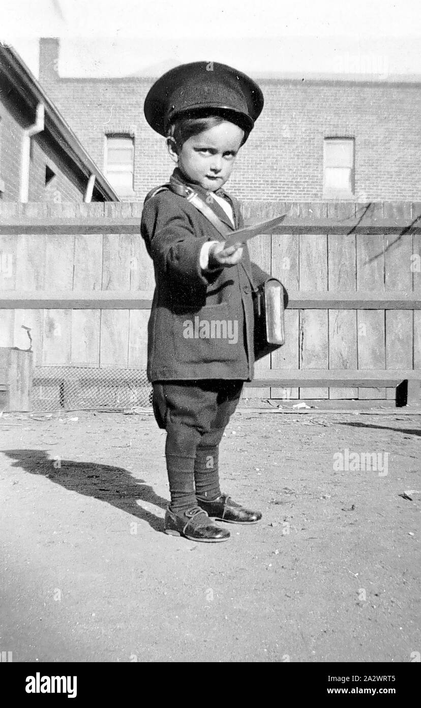 Negative - Swan Hill, Victoria, 1921, A small boy dressed as a postman ...