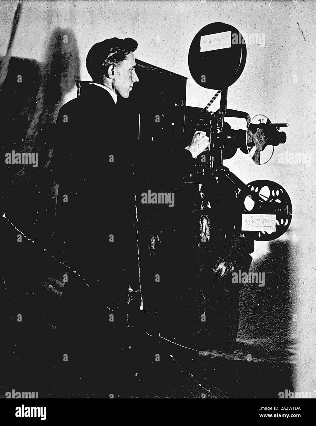 Man operating a projector hi-res stock photography and images - Alamy