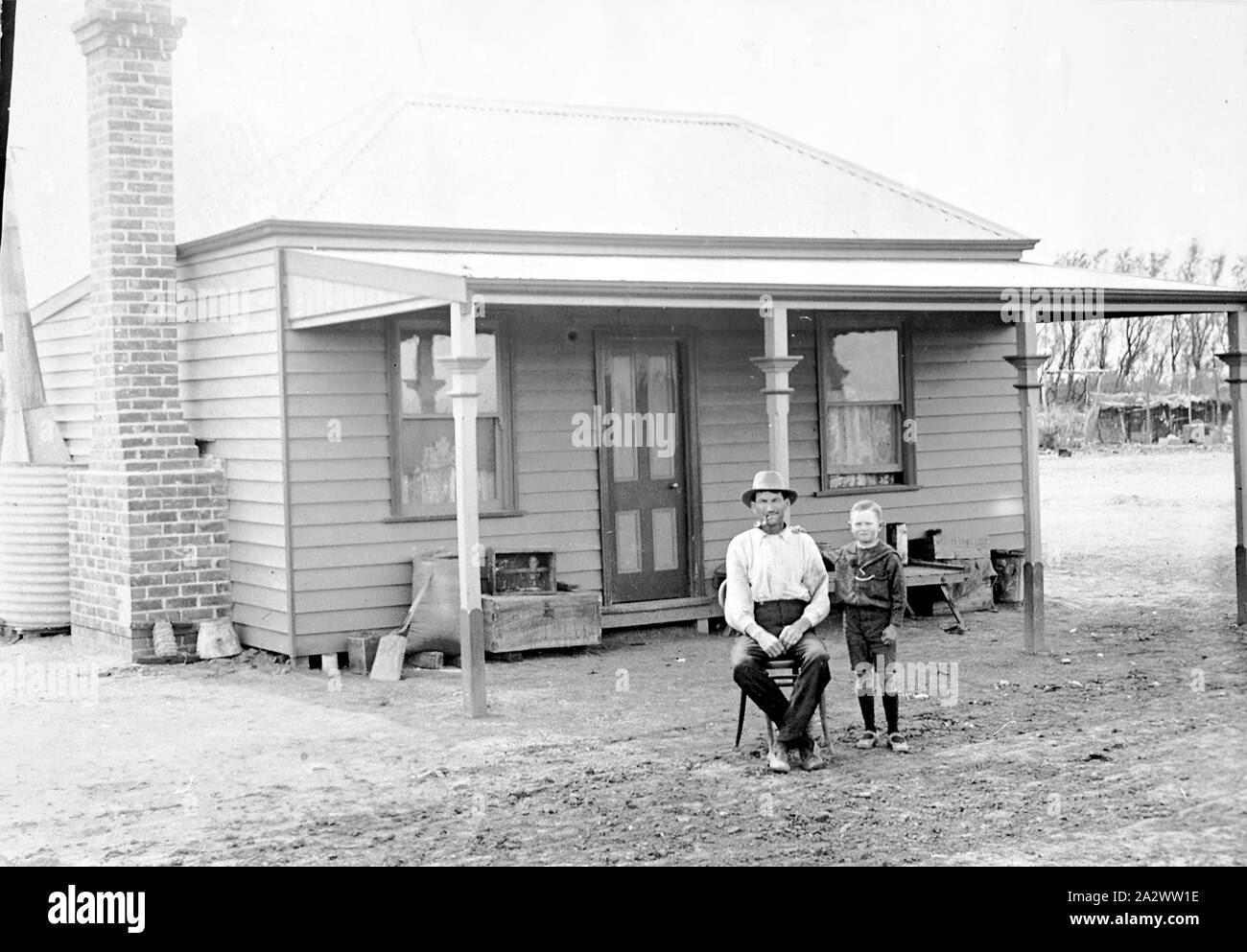 Negative - Merbein South, Victoria, 1911, A man and young boy in front ...